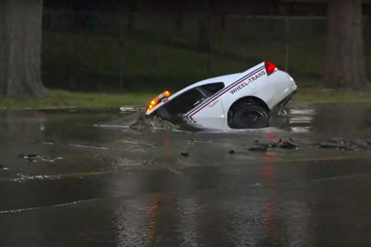 Car Gets Swallowed by a Sinkhole After Water Main Break - alt_driver